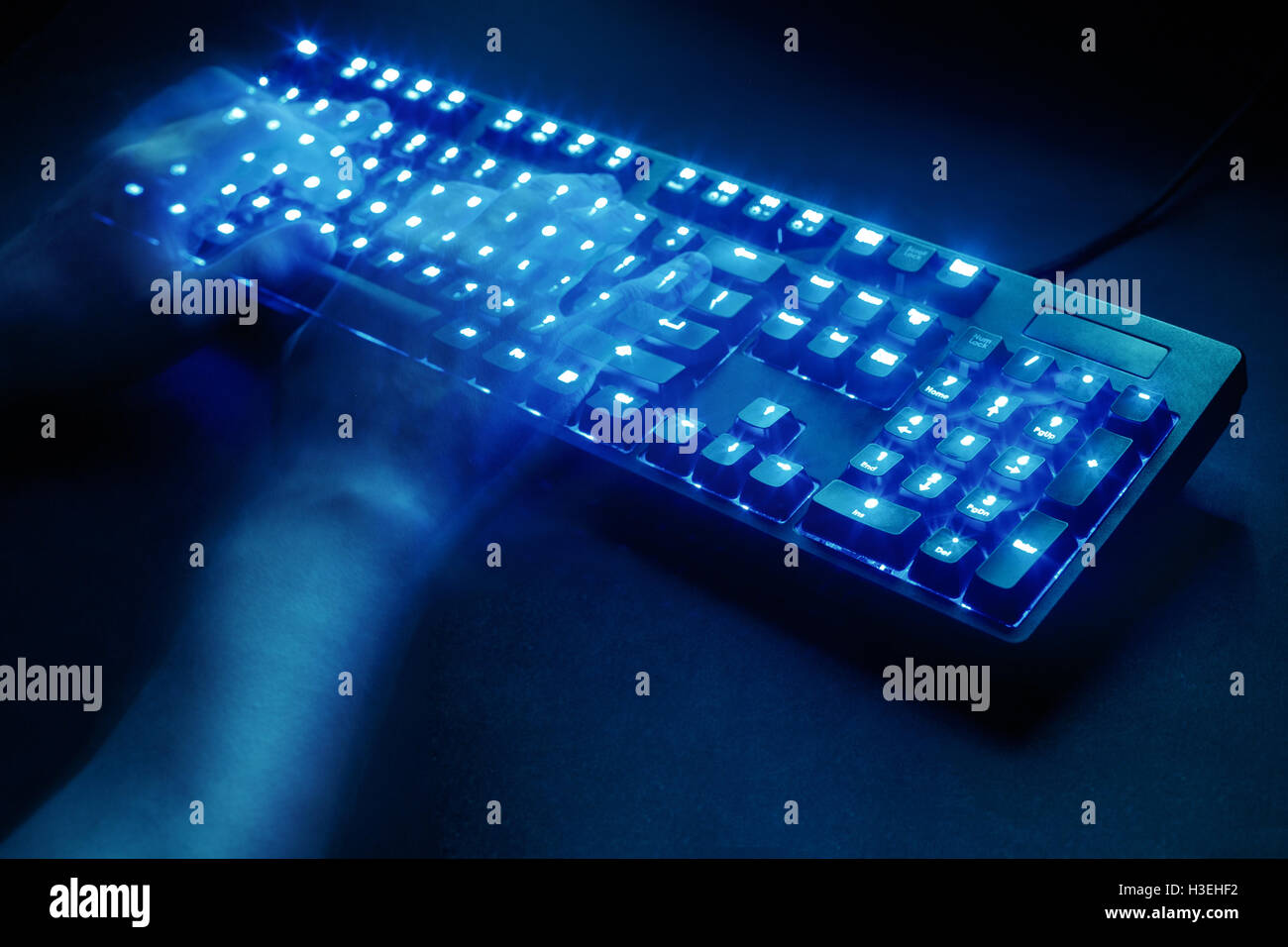 Illuminated Keyboard Male Hands Typing On A Computer Hacker Or