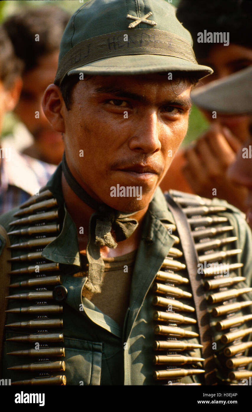El Salvador, 1986. Government soldiers in camouflage on patrol in in ...