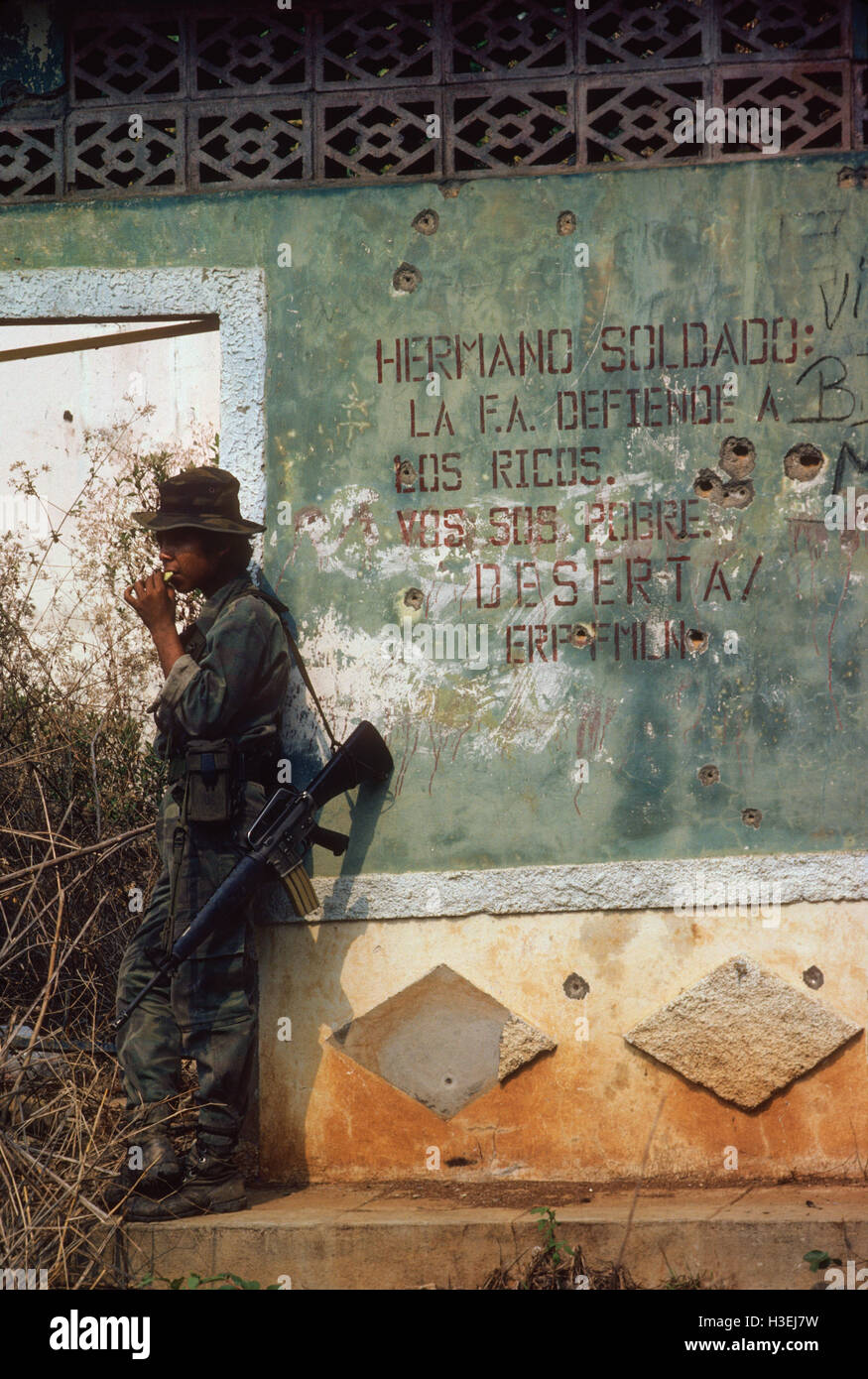 EL MOZOTE, MORAZAN PROVINCE, EL SALVADOR, MAY 1986: A soldier eats a ...