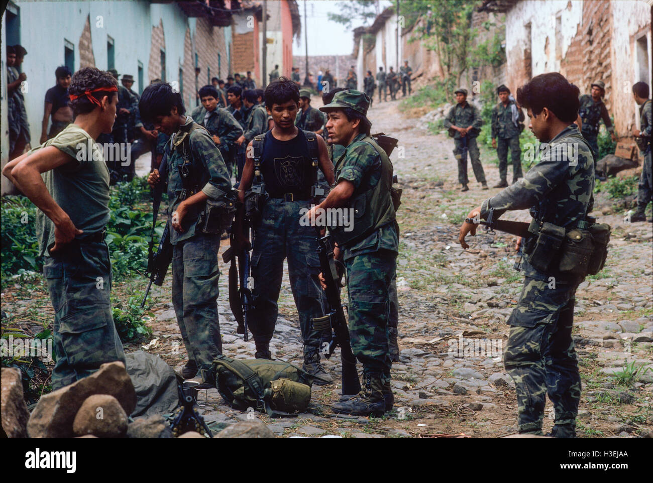 TENANCINGO, EL SALVADOR, July 1986: A soldiers relax after a patrol ...