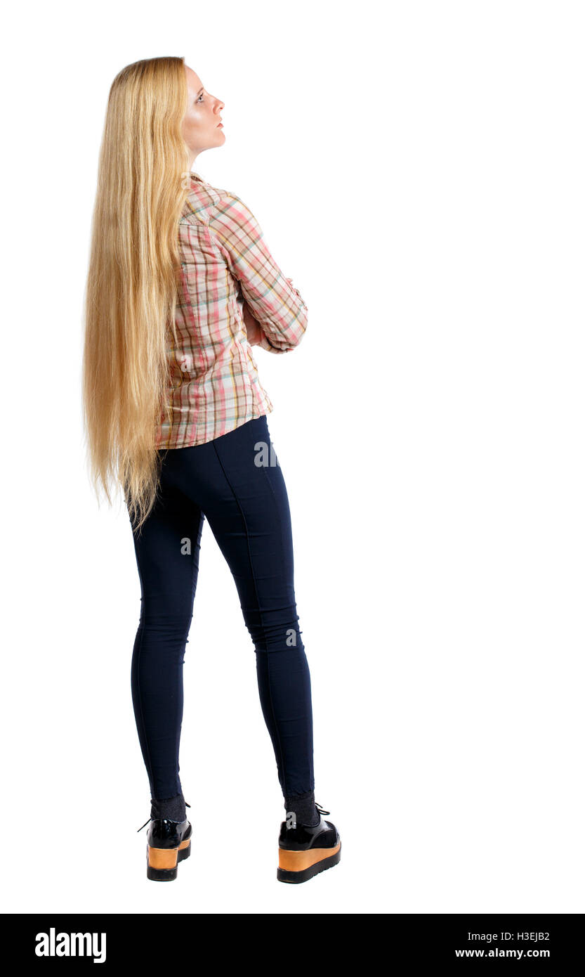 back view of standing young beautiful woman. girl watching. Rear view ...