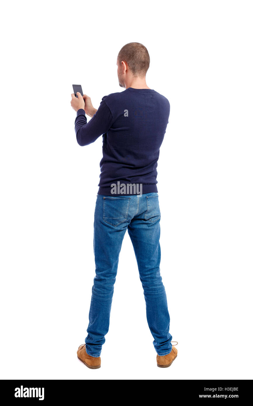 back view of man in suit talking on mobile phone. rear view people ...