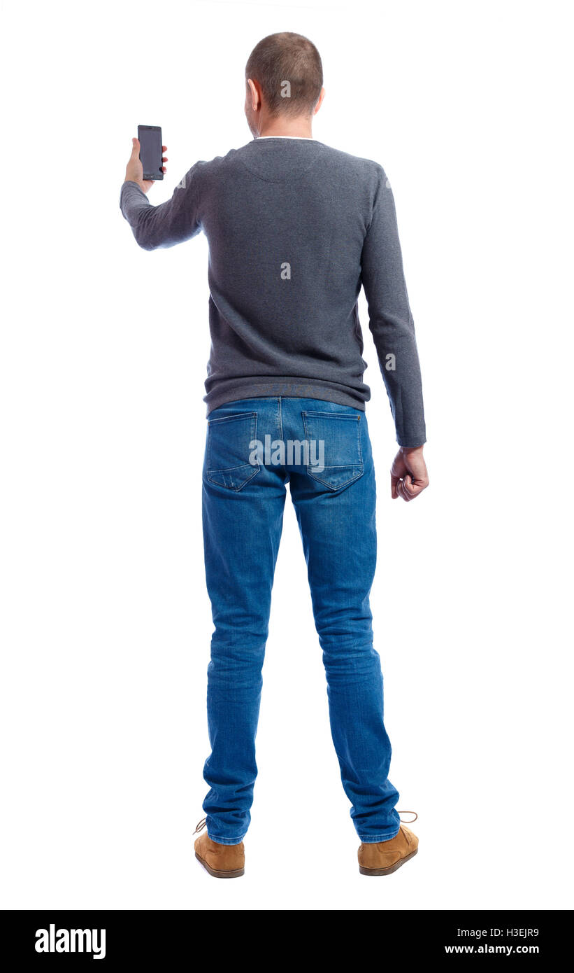 back view of man in suit talking on mobile phone. rear view people ...