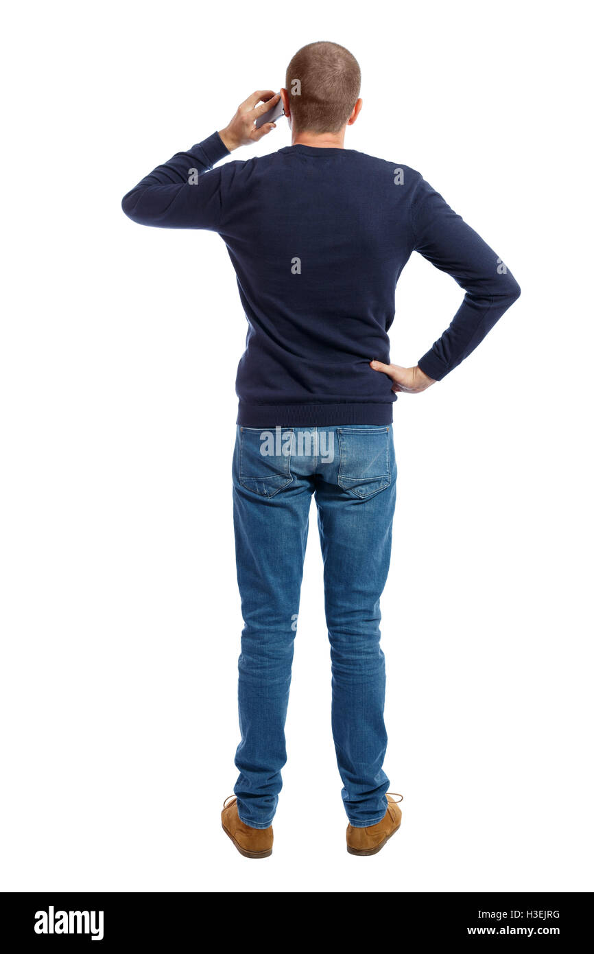 Back view of pointing young men talking on cell phone. Young guy ...