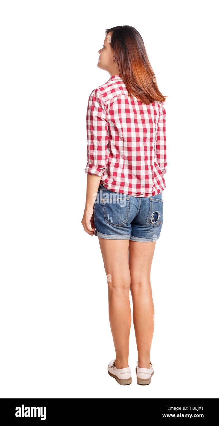 back view of standing young beautiful woman. girl watching. Rear view ...