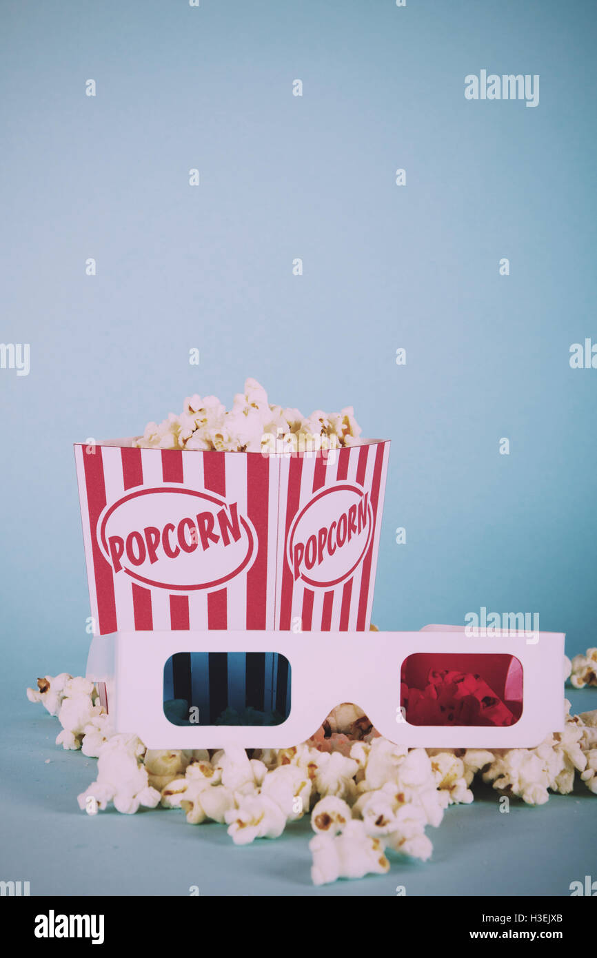 Bucket of popcorn against a blue background Vintage Retro Filter Stock ...