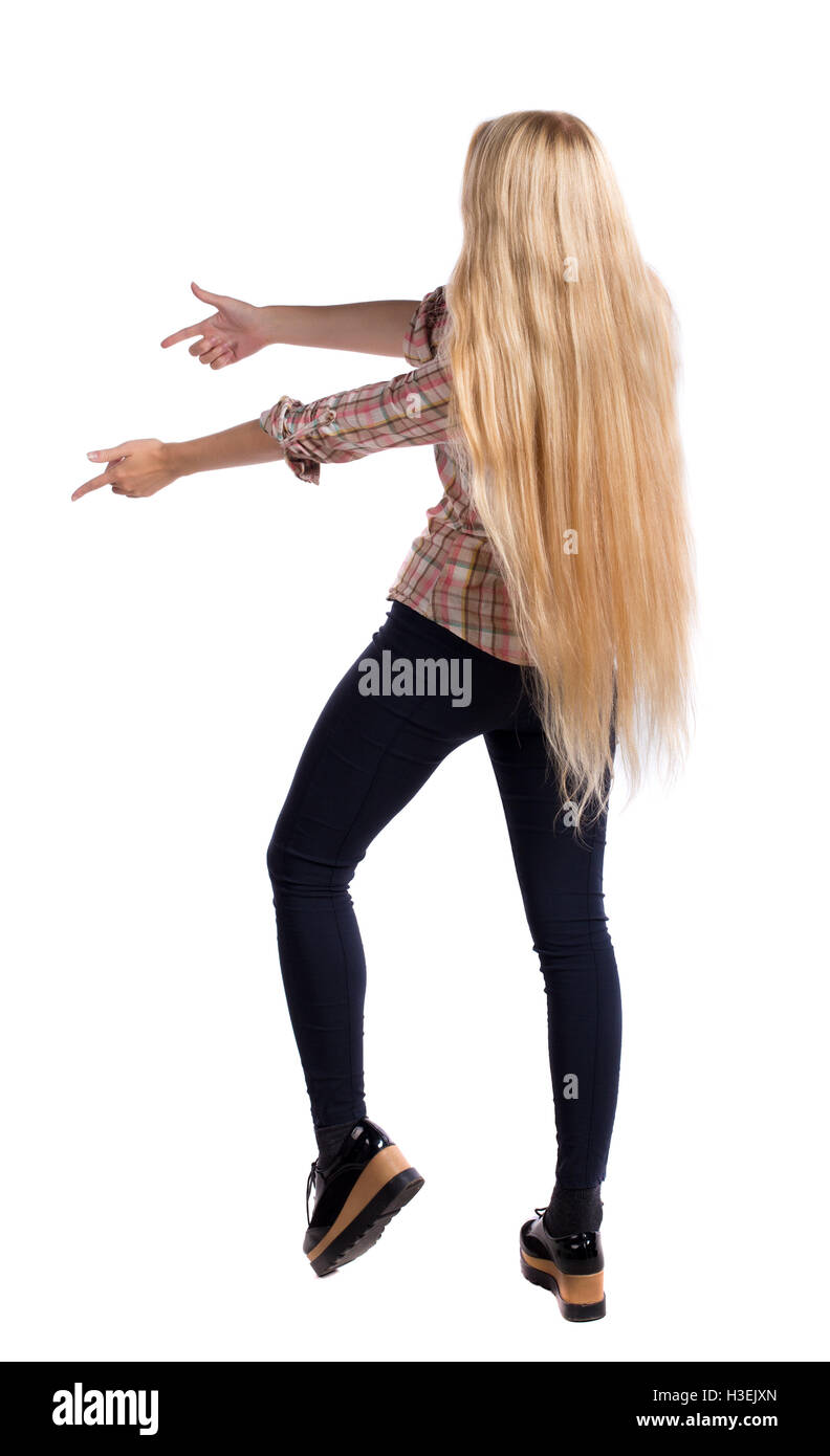 Back view of pointing woman. beautiful girl. Rear view people ...