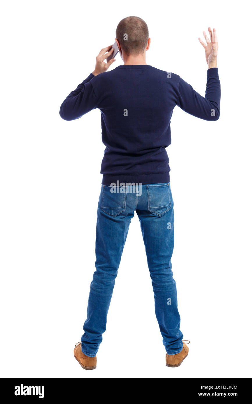 Back view of pointing young men talking on cell phone. Young guy ...
