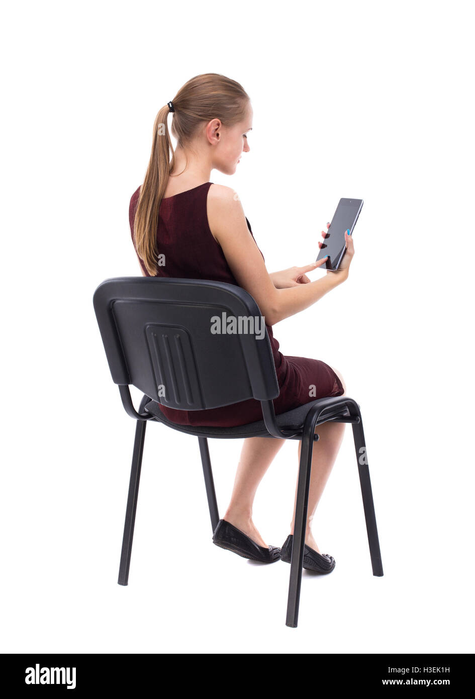 Female sitting on a chair back dress hi-res stock photography and ...