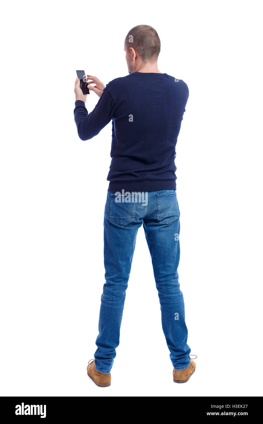 back view of man in suit talking on mobile phone. rear view people ...