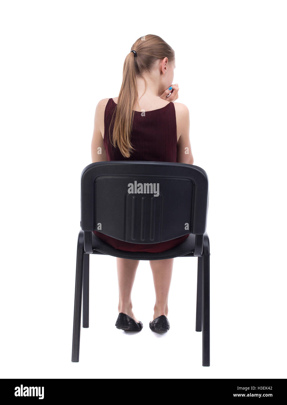 back view of young beautiful woman sitting on chair Stock Photo - Alamy