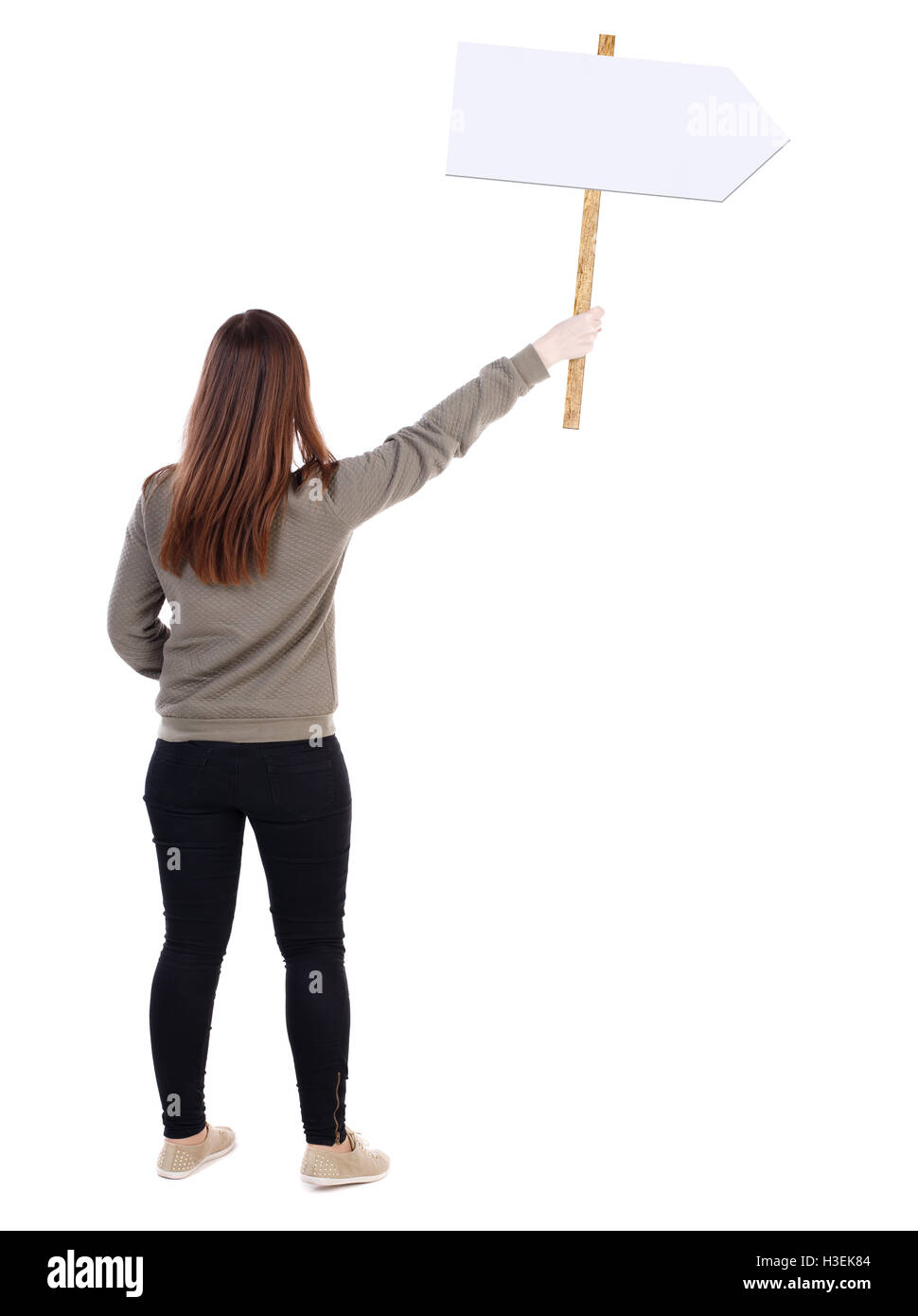 Back view woman showing sign board Stock Photo - Alamy