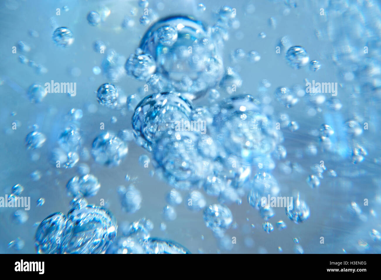 Bubbles in a crystal glass with blue tone. Horizontal Stock Photo - Alamy