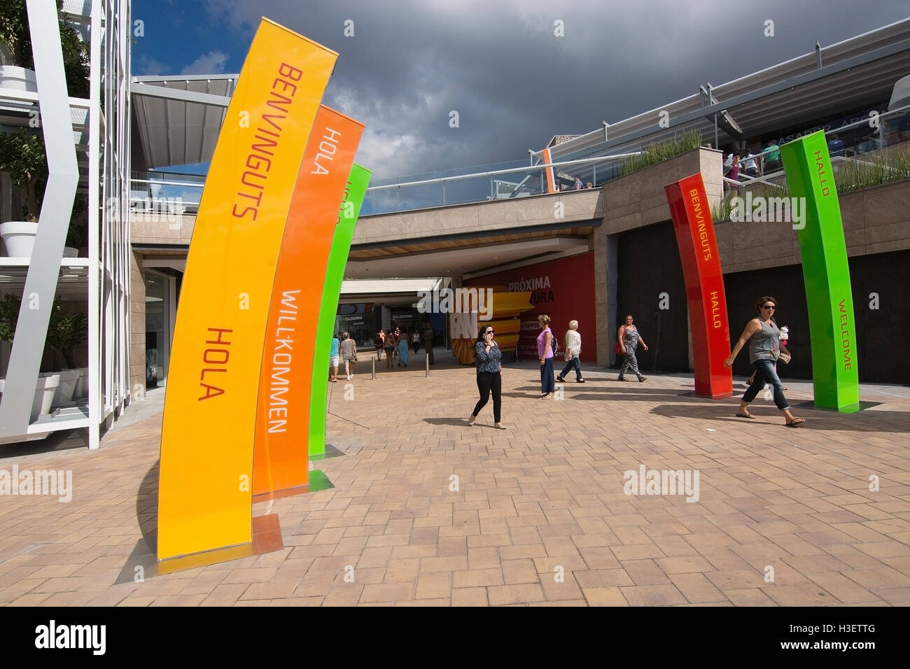 Colorful entrance welcome signs with shoppers in FAN Shopping Centre on ...