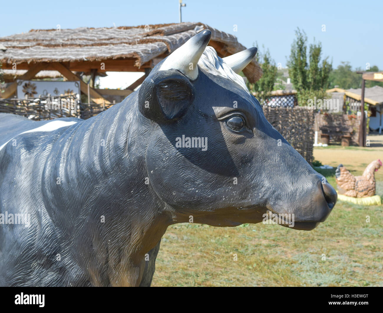 dummy cow. Black and white toy cow with a bell Stock Photo - Alamy