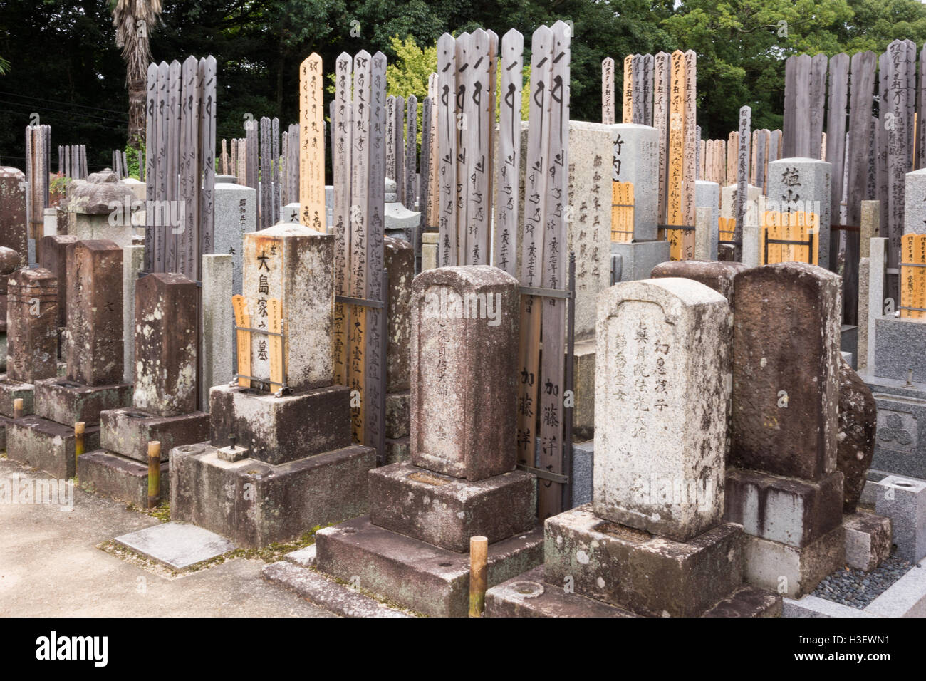 Row of older tomb stones at cemetery Stock Photo - Alamy