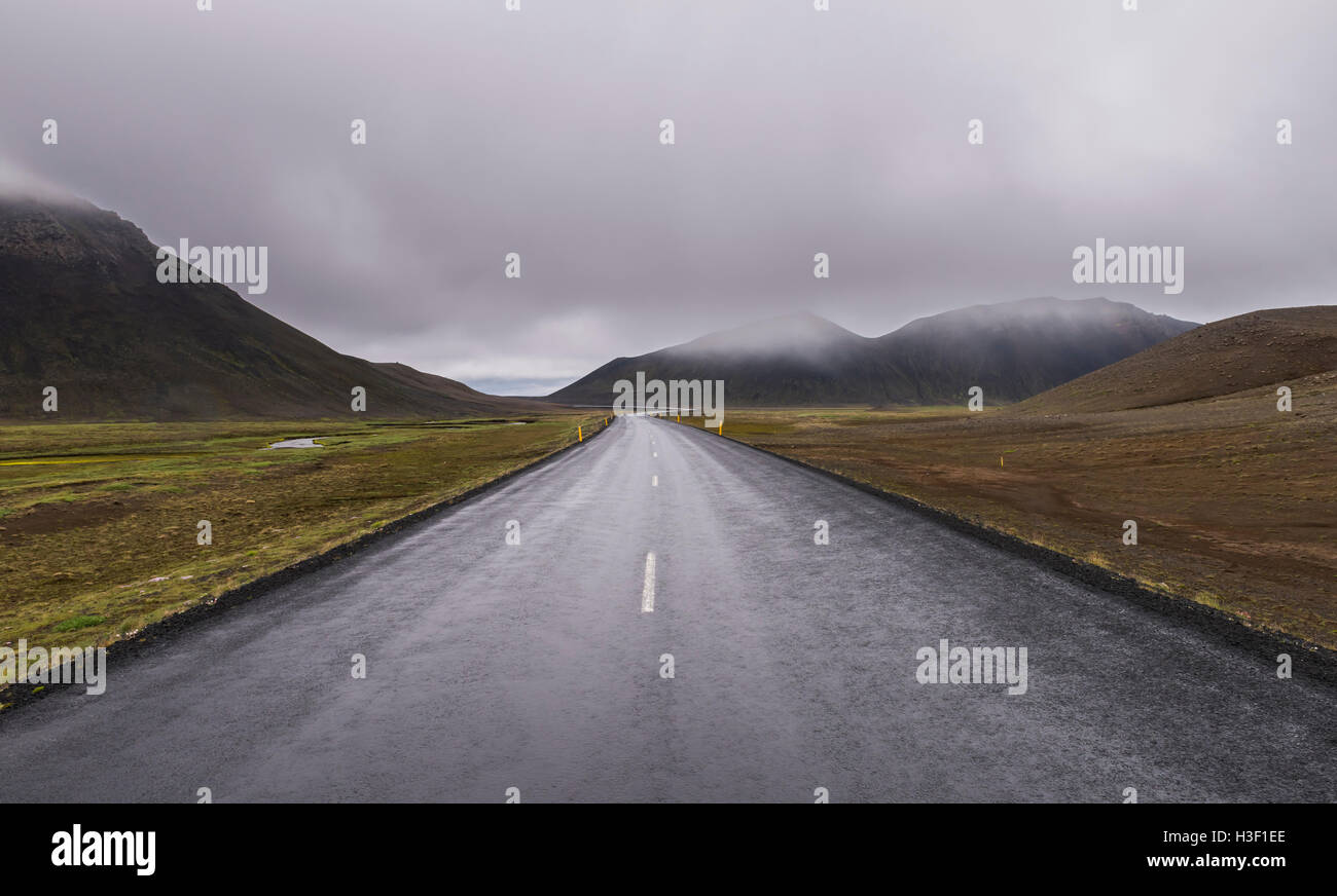 Rainy Road in Iceland with mountains and fog Stock Photo - Alamy