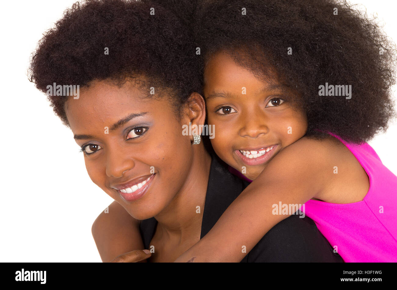 Black mother daughter posing happily Stock Photo - Alamy