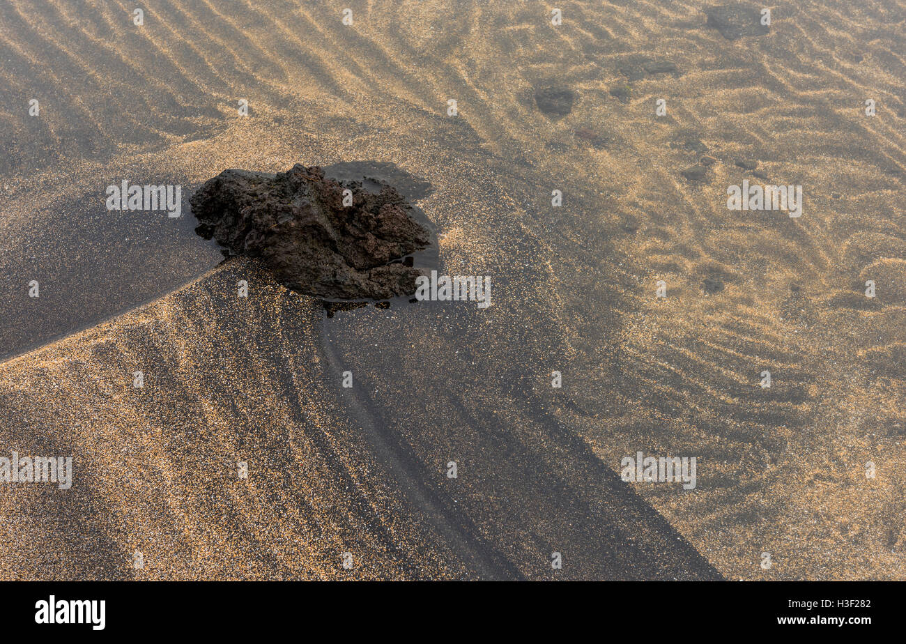 Lava Rock and Patterns of yellow and black lava and volcanic sand at a ...