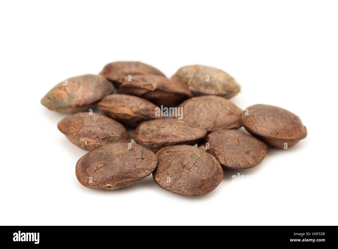 sacha inchi seeds isolated on white background Stock Photo - Alamy