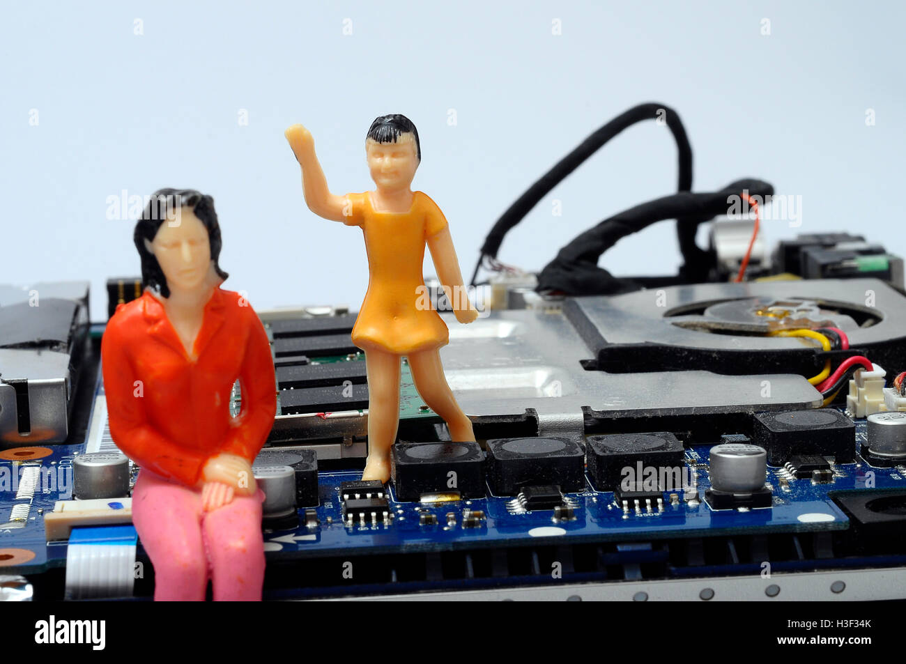 Close up of Disassembled computer components and people figurines Stock ...
