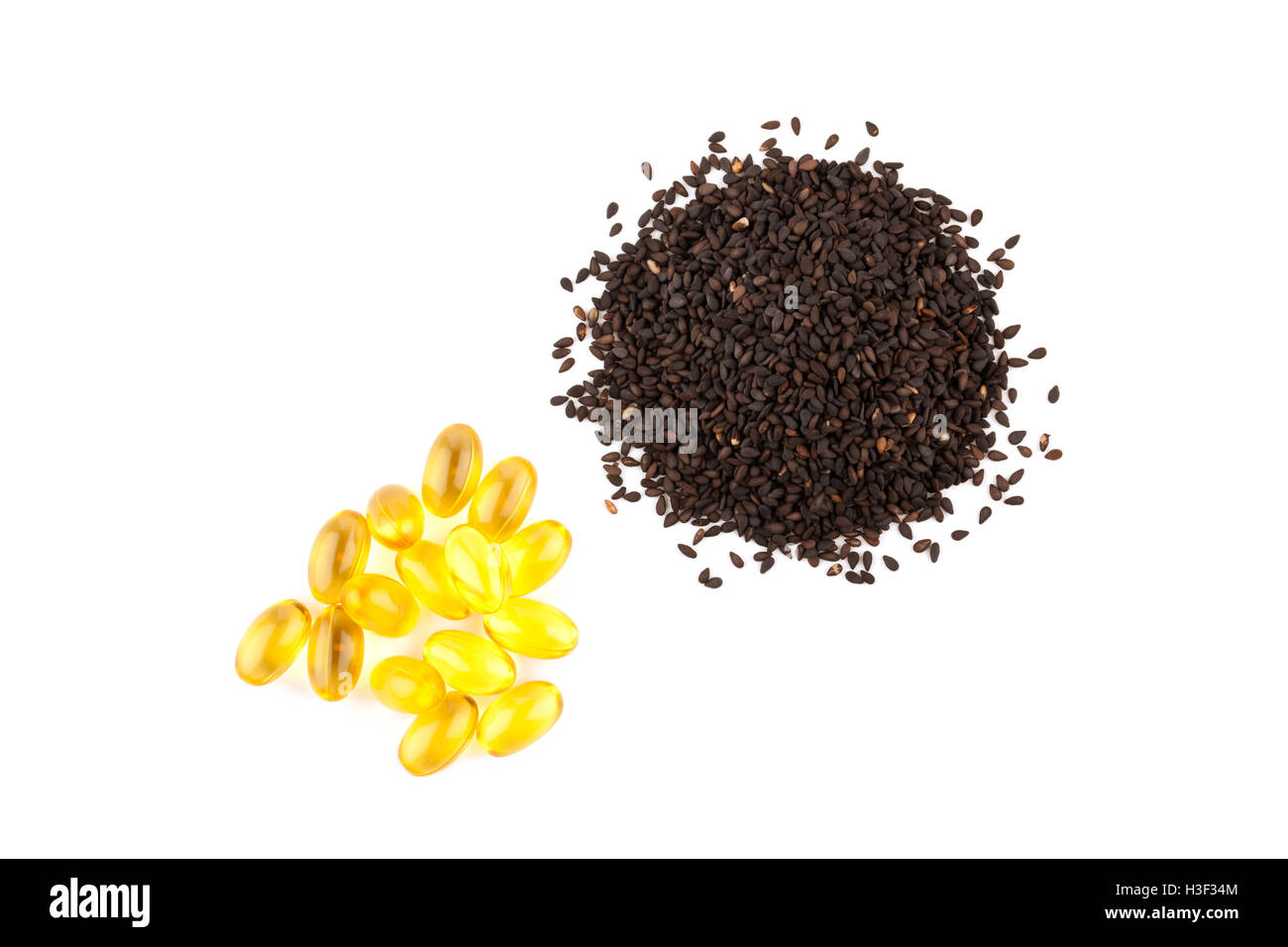 black sesame seeds and sesame oil capsule isolated on white background ...