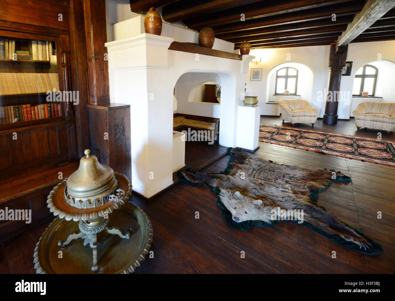 A wolf fur used as a carpet in a main living room inside Bran castle ...