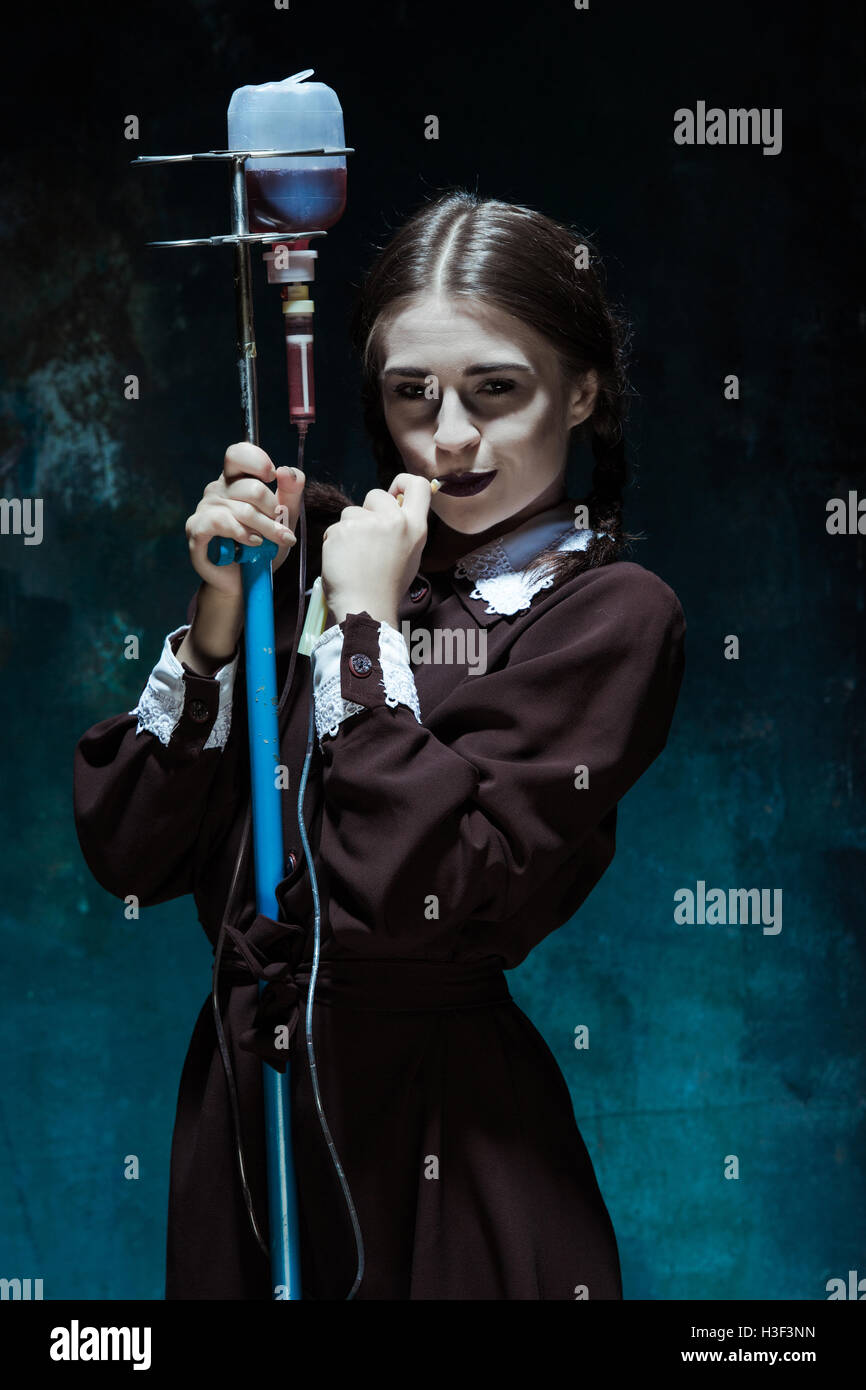 Portrait of a young girl in school uniform as a vampire woman Stock ...