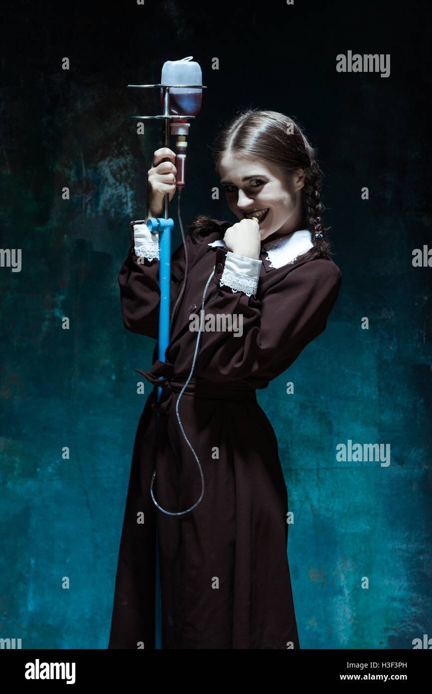 Portrait of a young girl in school uniform as a vampire woman Stock ...