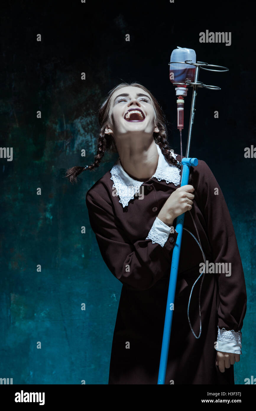 Portrait of a young girl in school uniform as a vampire woman Stock ...