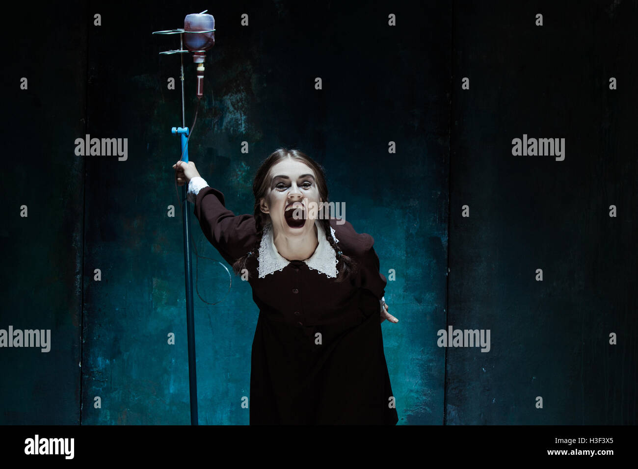 Portrait of a young girl in school uniform as a vampire woman Stock ...