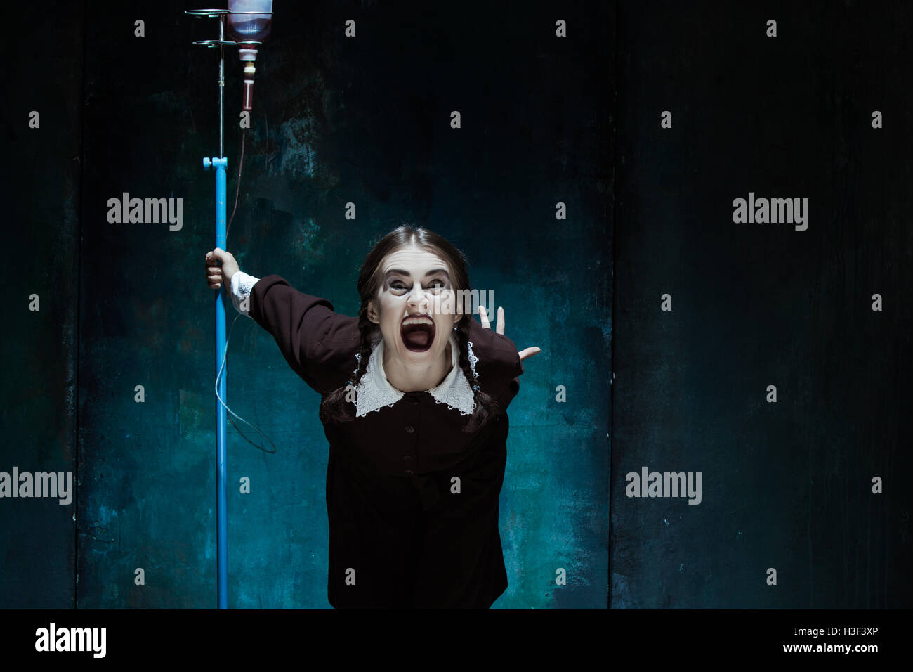 Portrait of a young girl in school uniform as a vampire woman Stock ...