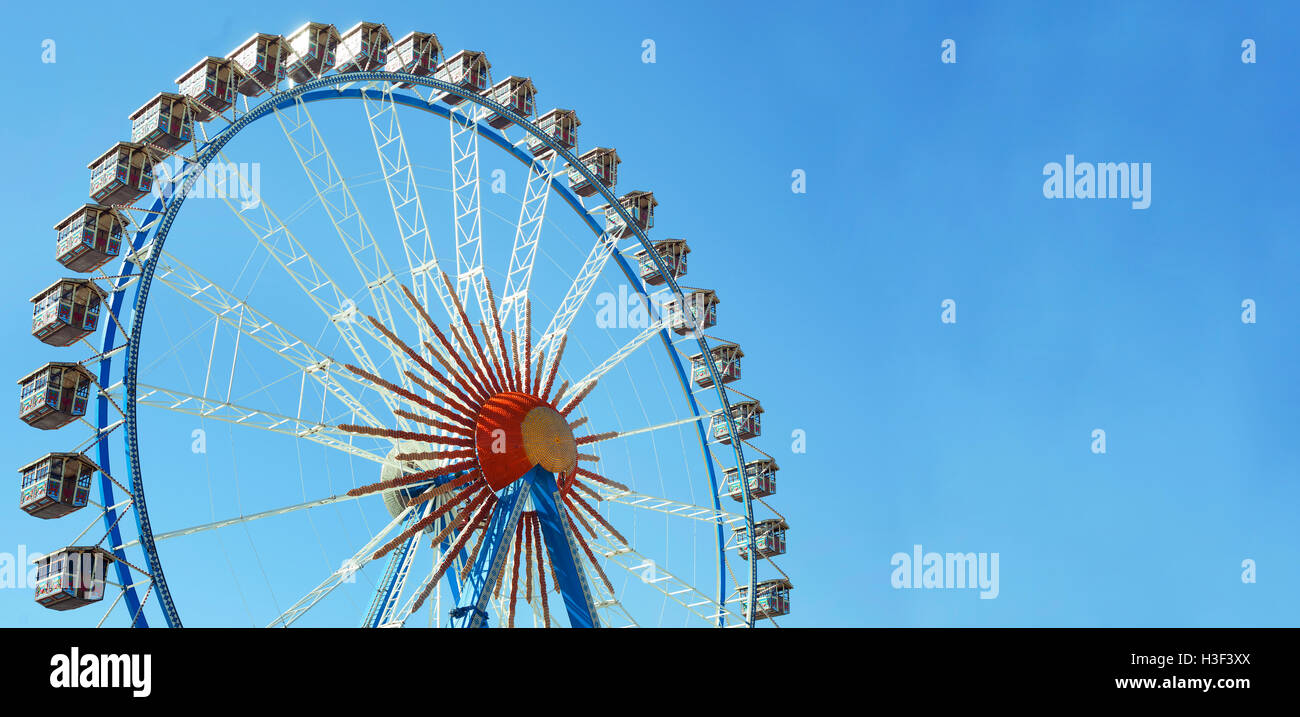 Big ferris wheel over blue sky Stock Photo - Alamy