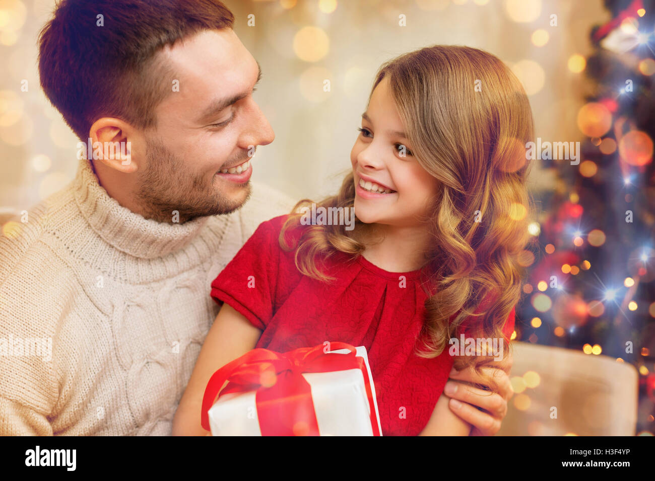 smiling father and daughter looking at each other Stock Photo - Alamy
