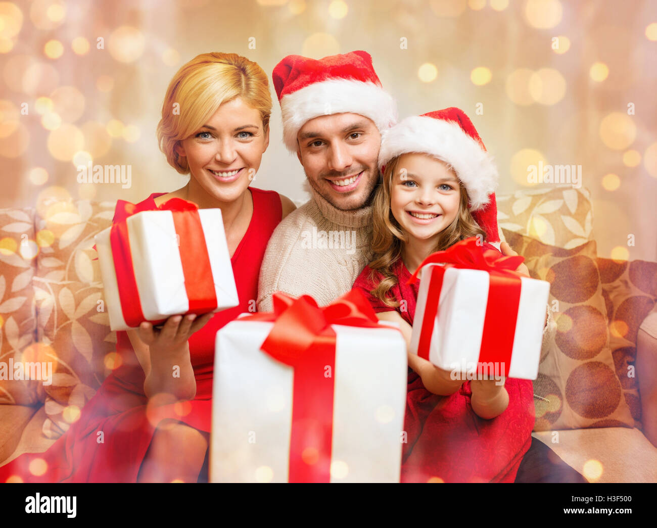 smiling family giving many gift boxes Stock Photo - Alamy