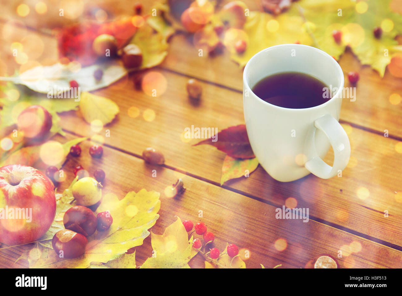 close up of tea cup on table with autumn leaves Stock Photo - Alamy