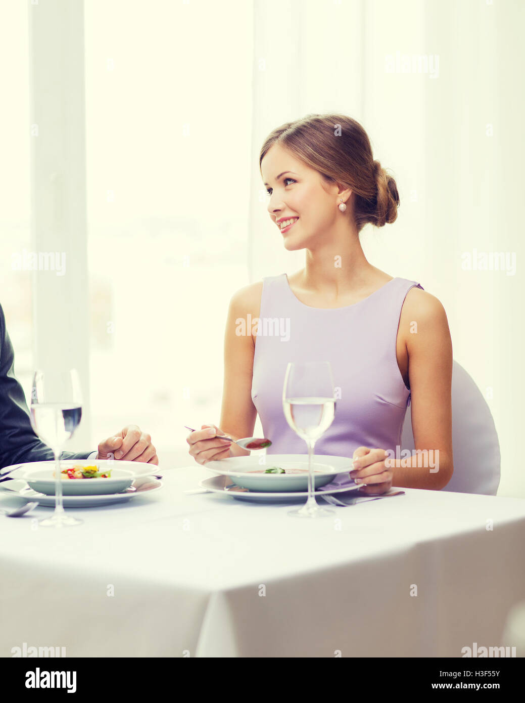 young woman looking at husband or boyfriend Stock Photo - Alamy