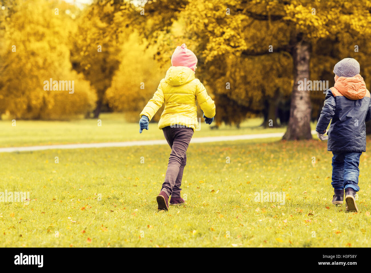 group of happy little kids running outdoors Stock Photo - Alamy