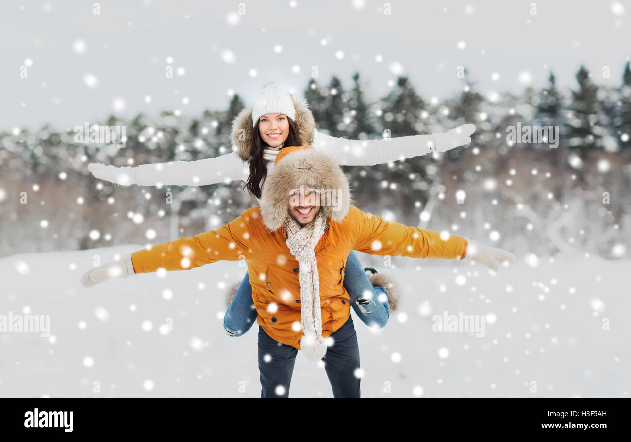 happy couple having fun over winter background Stock Photo - Alamy