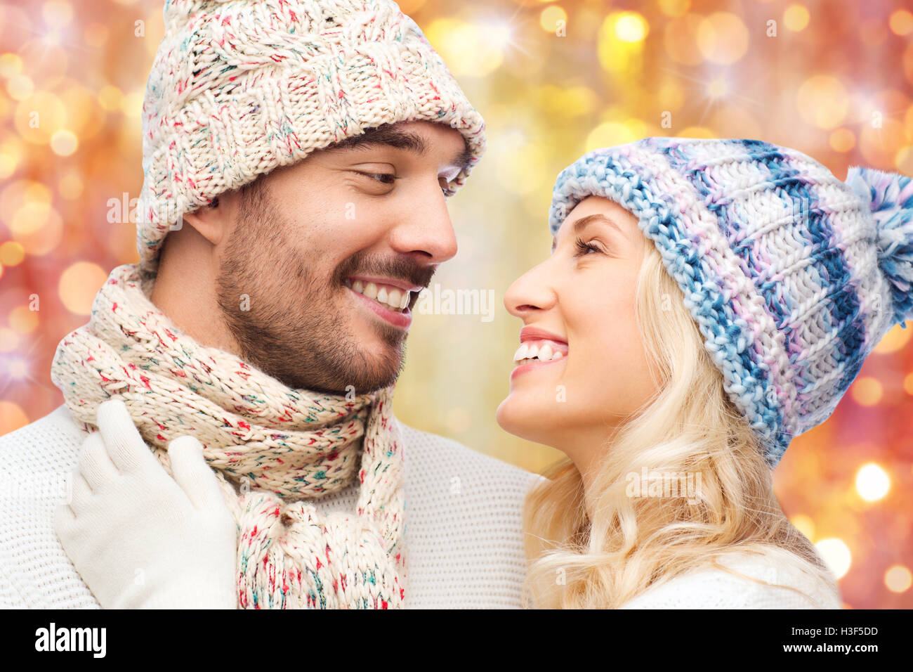 close up of couple in winter clothes hugging Stock Photo - Alamy