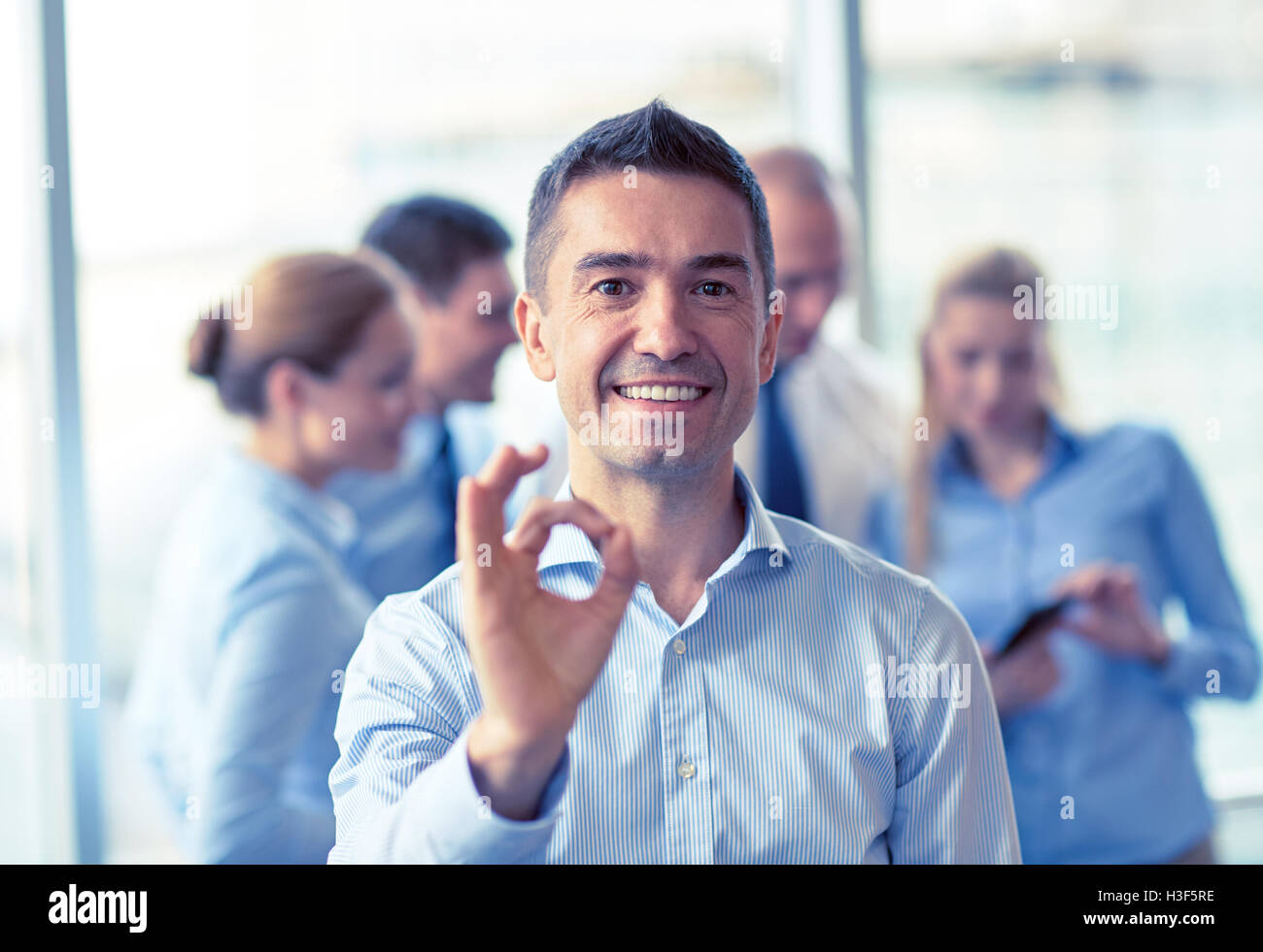 group of smiling businesspeople meeting in office Stock Photo - Alamy