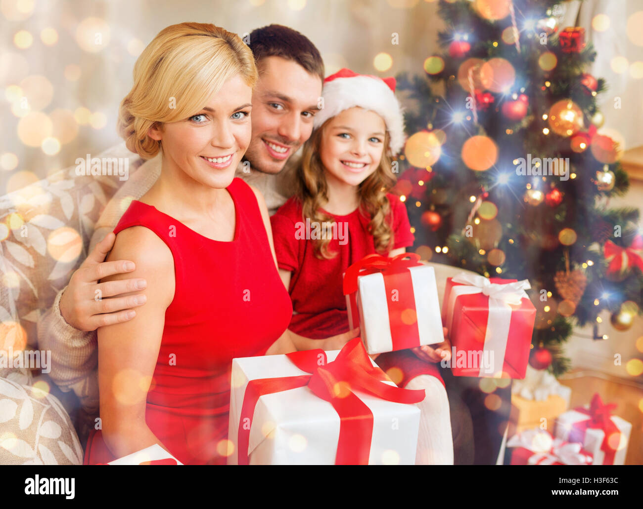 smiling family holding many gift boxes Stock Photo - Alamy