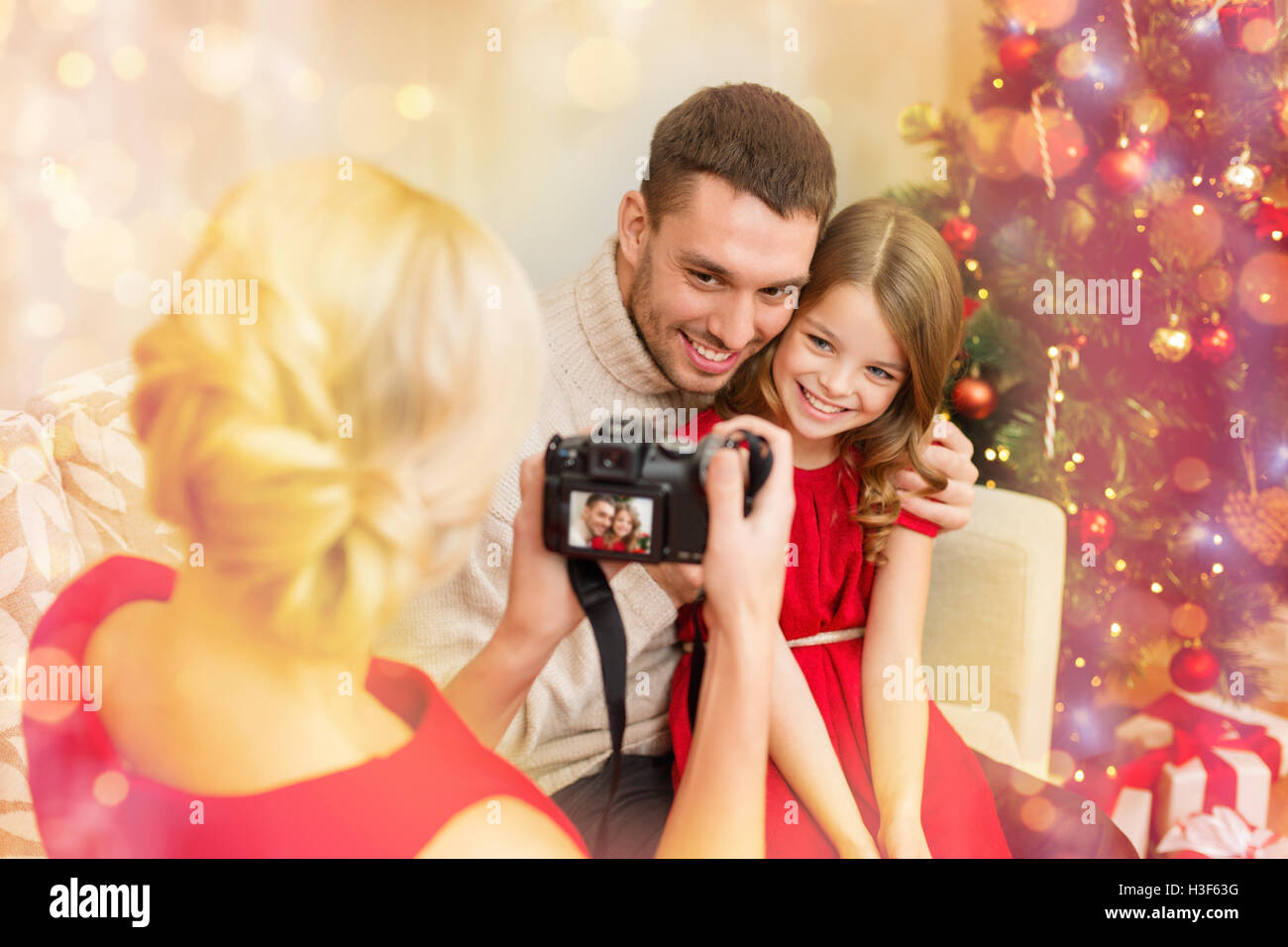 mother taking picture of father and daughter Stock Photo - Alamy