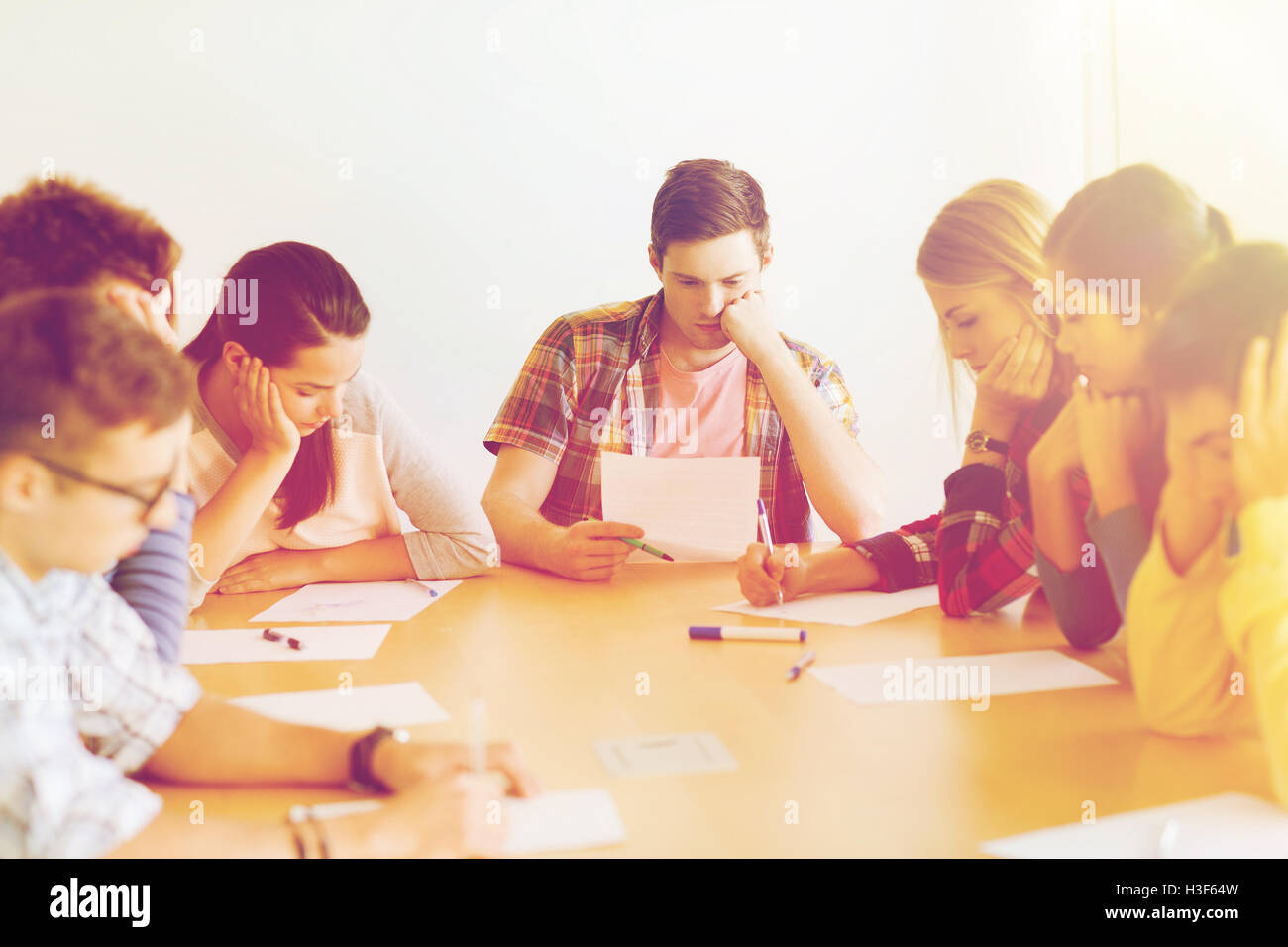 group of students with papers Stock Photo - Alamy