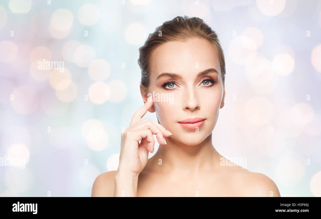 beautiful young woman showing her cheekbone Stock Photo - Alamy