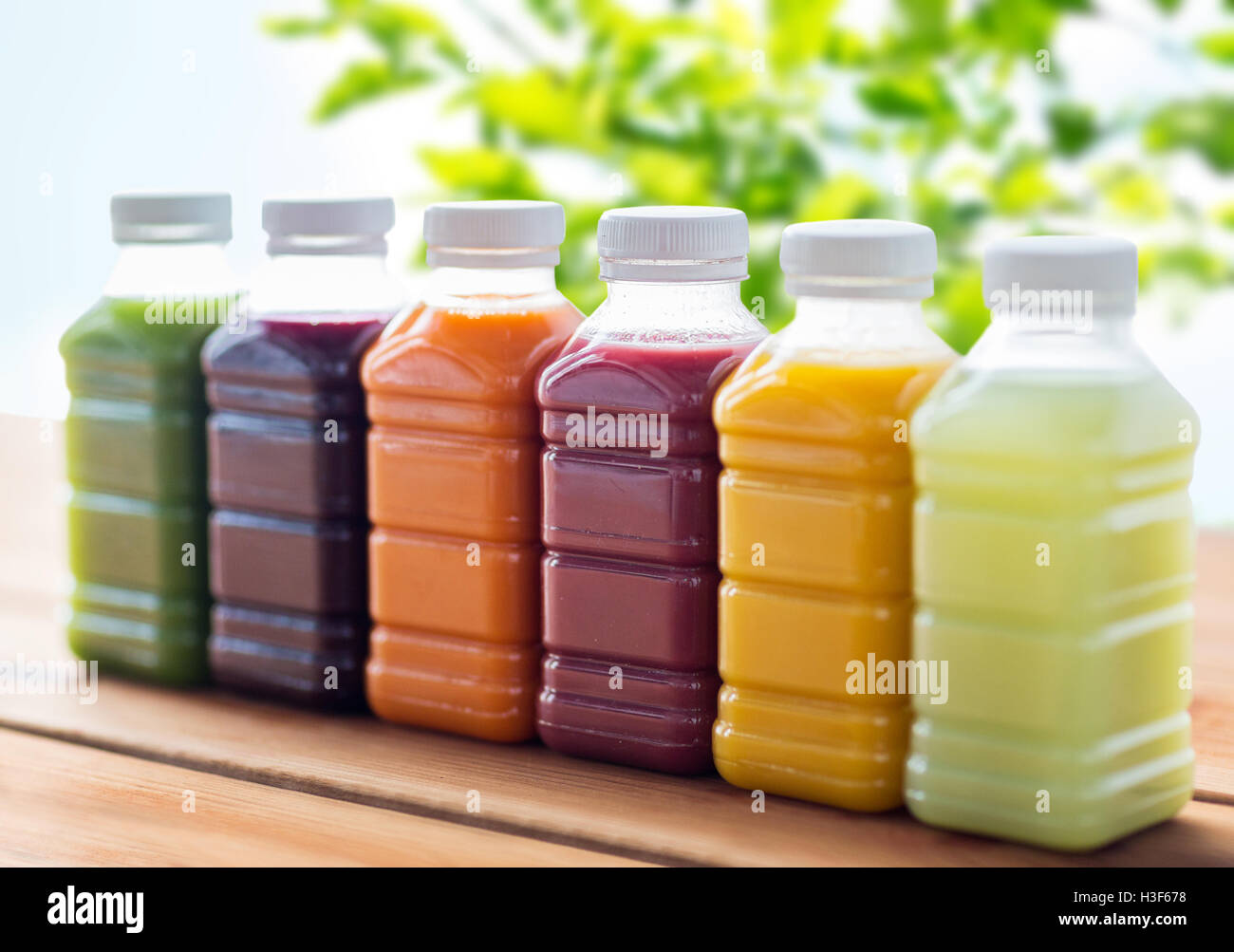 bottles with different fruit or vegetable juices Stock Photo - Alamy