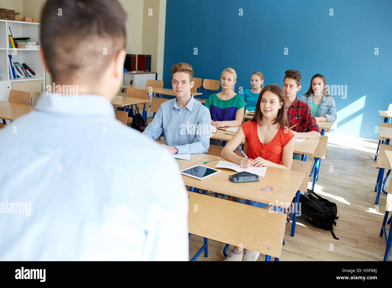 group of students and teacher at school lesson Stock Photo - Alamy