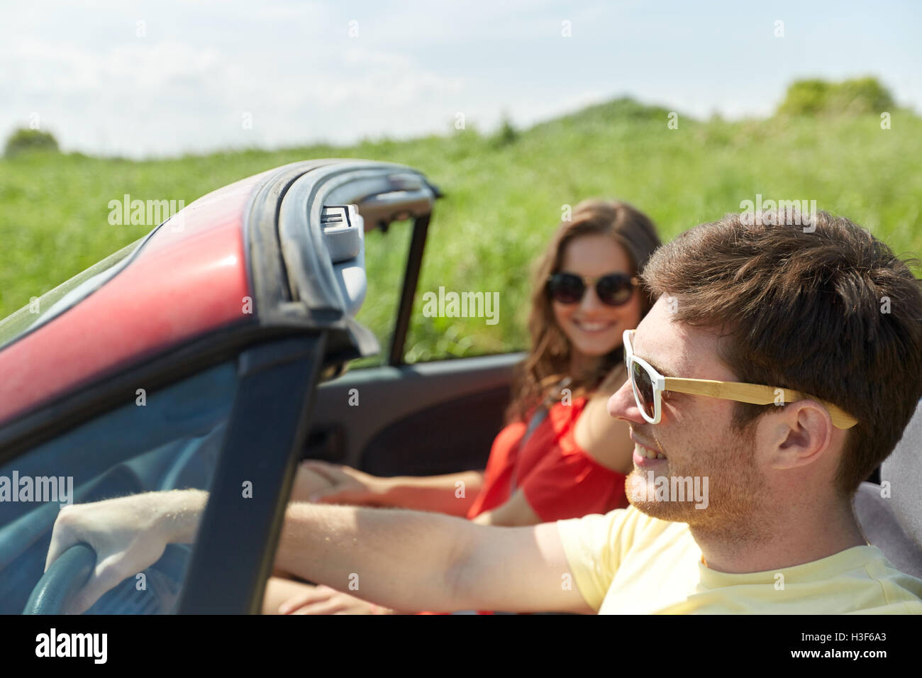 happy couple driving in cabriolet car at country Stock Photo - Alamy