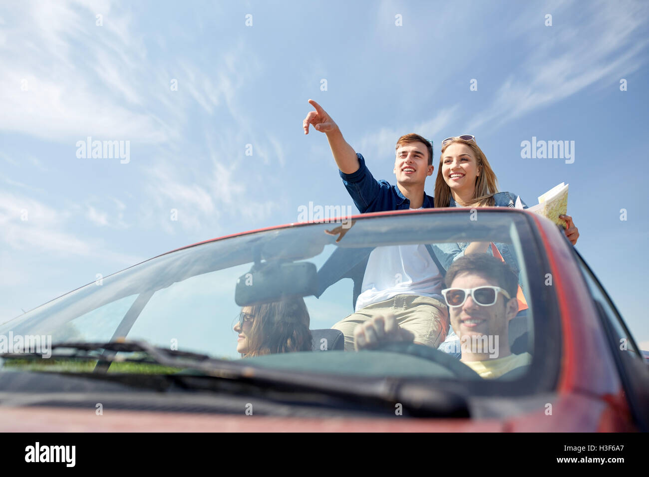 happy friends driving in cabriolet car Stock Photo - Alamy
