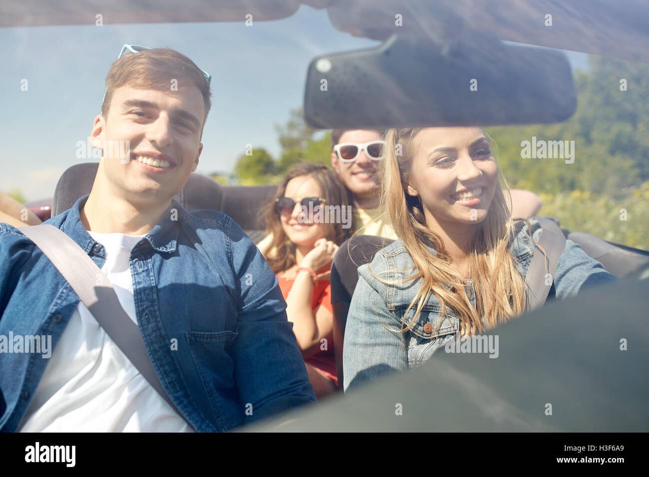 happy friends driving in cabriolet car Stock Photo - Alamy